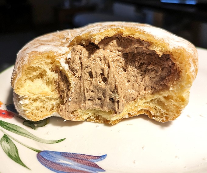 Behold the cross-section of donut perfection &ndash; where pillowy dough meets creamy chocolate filling in a marriage made in pastry heaven.