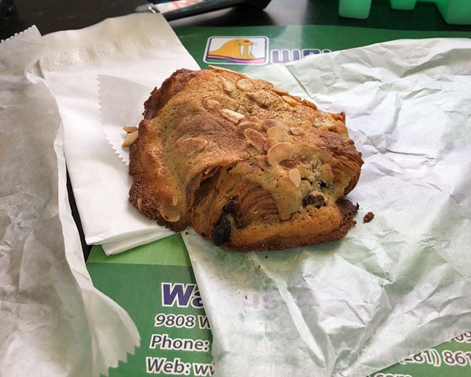 Chocolate croissants should be judged by the mess they leave on your shirt. This almond-topped beauty promises the kind of dignified chaos worth every napkin.