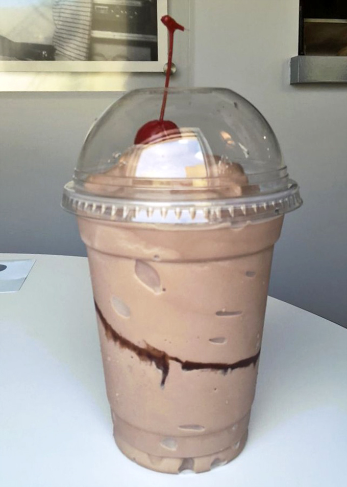 Chocolate shake nirvana awaits beneath that dome lid&mdash;thick enough for spoon archaeology but still technically sippable through a straw.