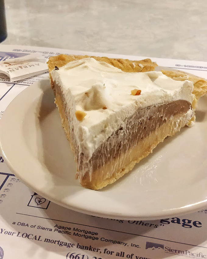 That chocolate pie slice stands tall and proud, like it knows it's about to change your life.