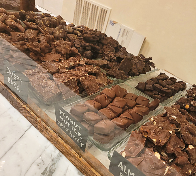 Chocolate paradise arranged with military precision. These aren't just candies; they're tiny edible masterpieces waiting to solve all of life's problems.