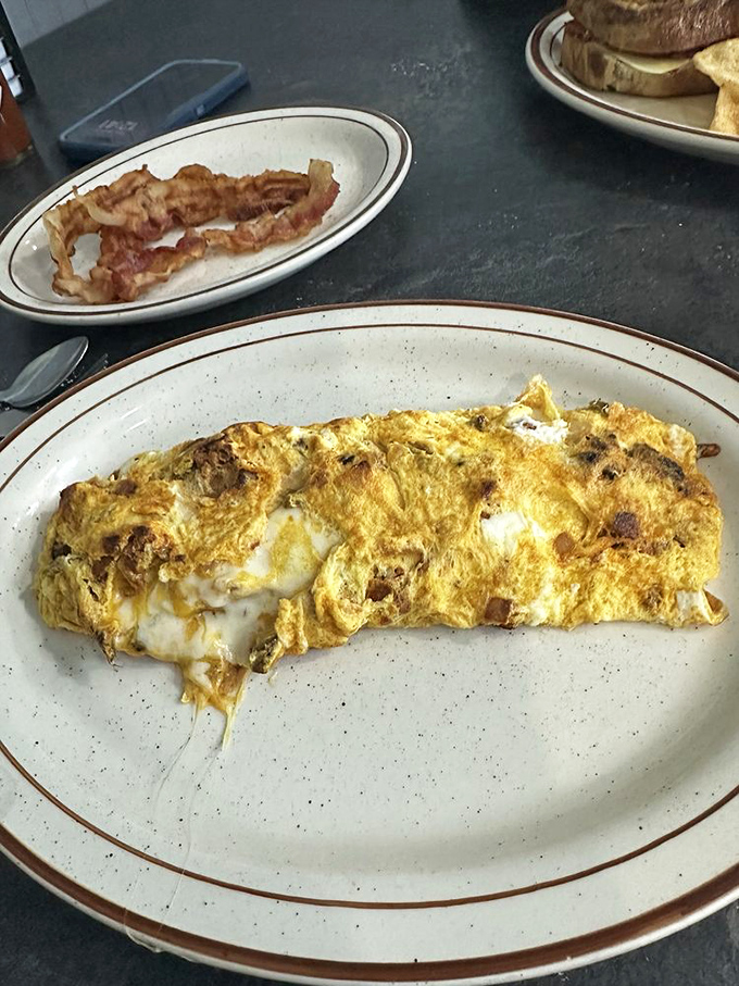 The humble chorizo omelet, elevated to an art form. That perfect fold harbors melty cheese treasures waiting to be discovered.
