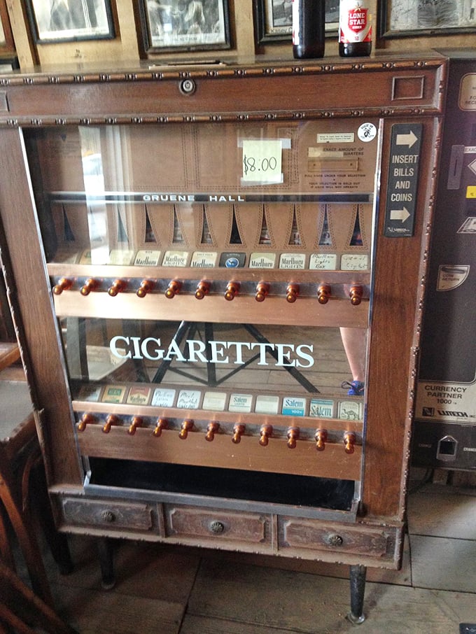 A vintage cigarette machine stands as a smoky relic of bygone days, when a pack of Marlboros and a cold beer were standard dance hall accessories.