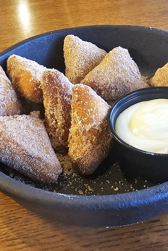 Cinnamon bites dusted with powdered sugar, waiting to be dunked in that creamy dipping sauce. Dessert masquerading as breakfast? I'm not complaining!