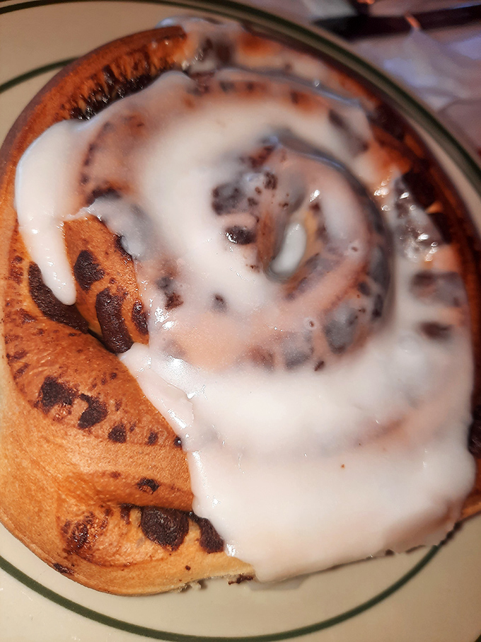 The holy grail of breakfast pastries: a cinnamon roll with icing so perfectly melted it looks like it's posing for its glamour shot.