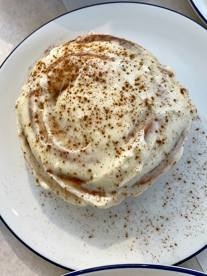 This cinnamon roll isn't just breakfast&mdash;it's an event. Swirls of cinnamon, clouds of cream cheese frosting, and a sprinkle of spice that whispers, "Take your time with me."