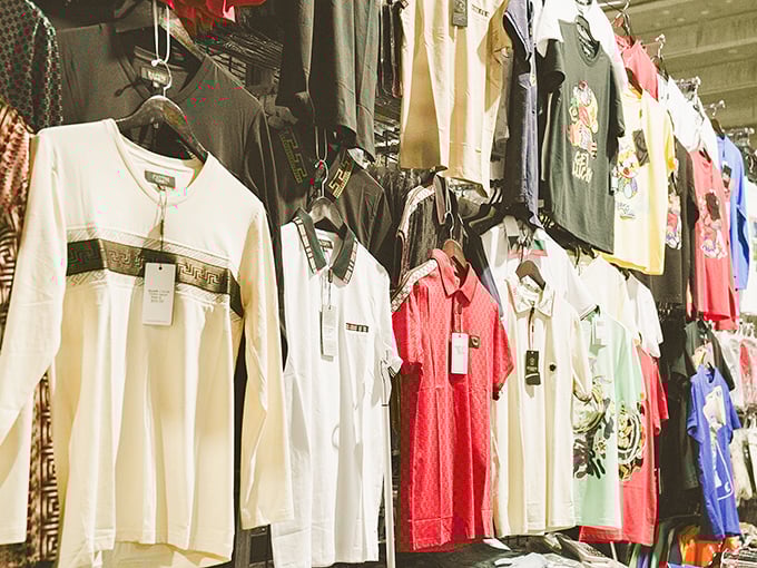 Fashion racks stretching endlessly like a department store that forgot when to stop - choices for days.