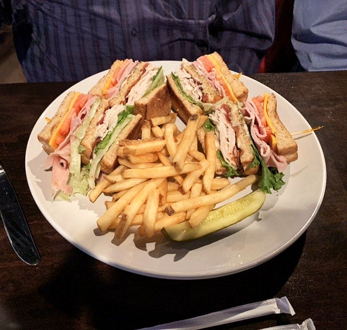 The club sandwich &ndash; that three-story architectural marvel of bread, meat, and vegetables that requires a dislocated jaw to consume properly.