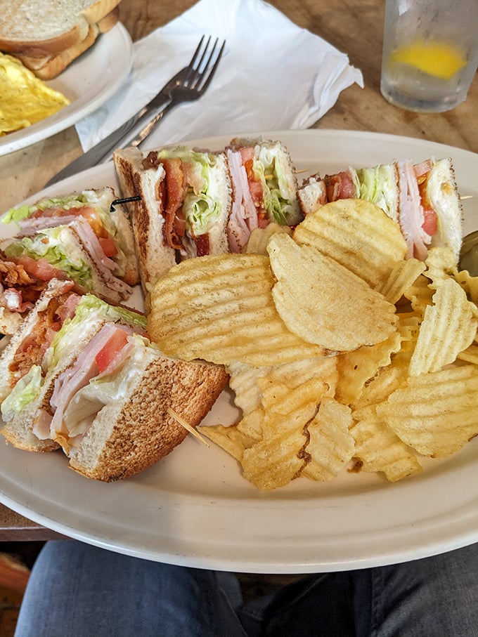 The club sandwich: where turkey, bacon, and veggies come together in perfect harmony, like the Beatles of lunch options.