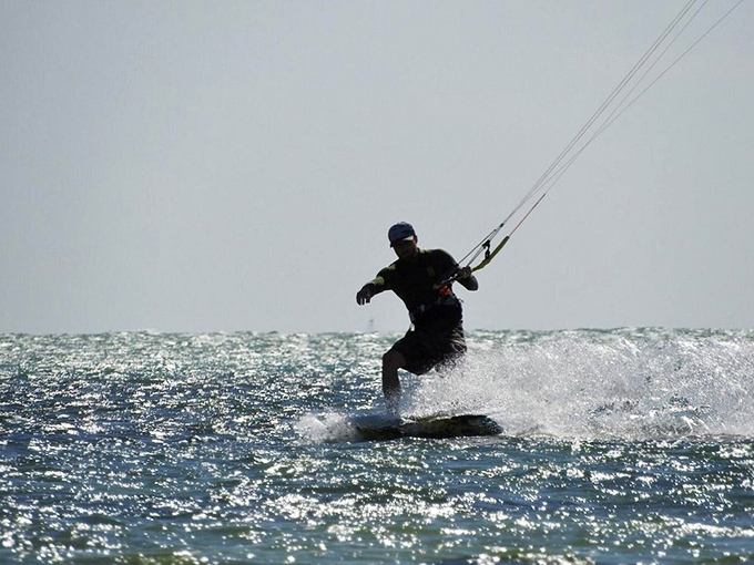 Kiteboarding at Anne's Beach&mdash;where locals get their adrenaline fix while the rest of us just try not to spill our coconut water.