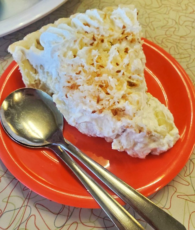 Coconut cream pie that would make your grandmother both proud and jealous. That towering meringue isn't just dessert&mdash;it's architecture with a sweet purpose.