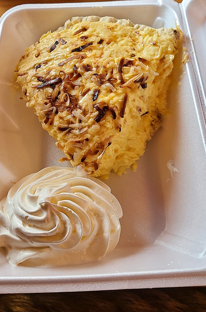 Coconut cream pie that would make your grandmother simultaneously proud and jealous. That swirl of whipped cream? Pure showmanship.