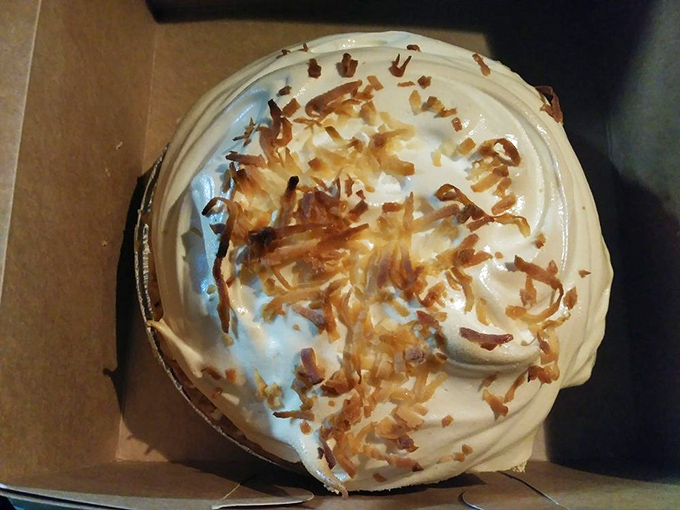 Coconut cream pie topped with toasted shards of paradise. The kind of dessert that makes you cancel your other plans.