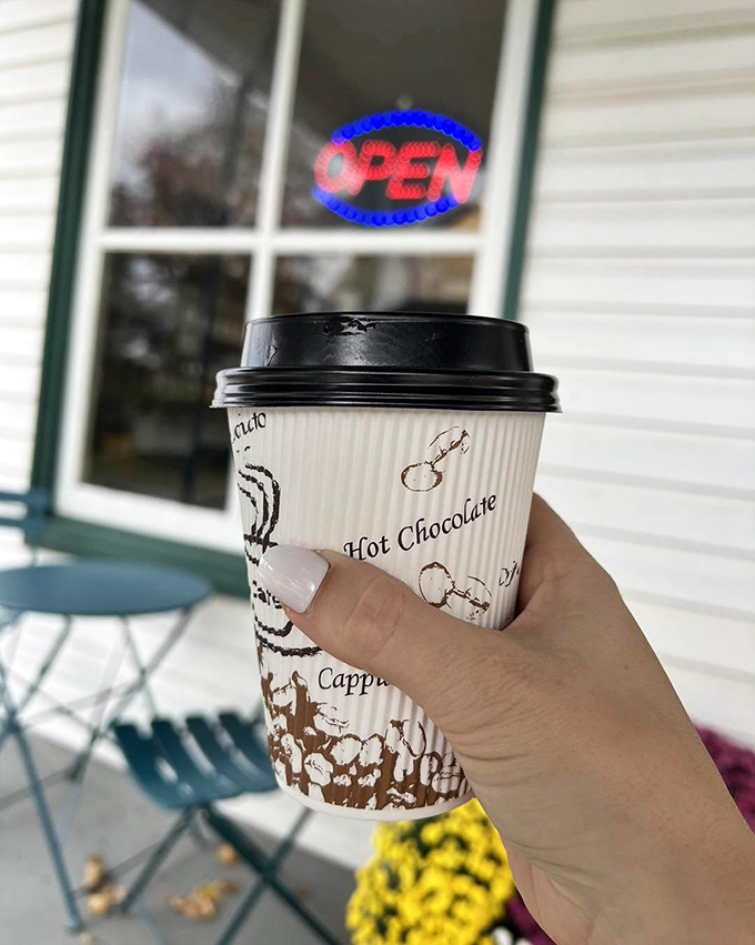 Coffee in hand, world at bay. Sometimes the simplest pleasures – like this steaming cup outside a country store – outshine five-star experiences.