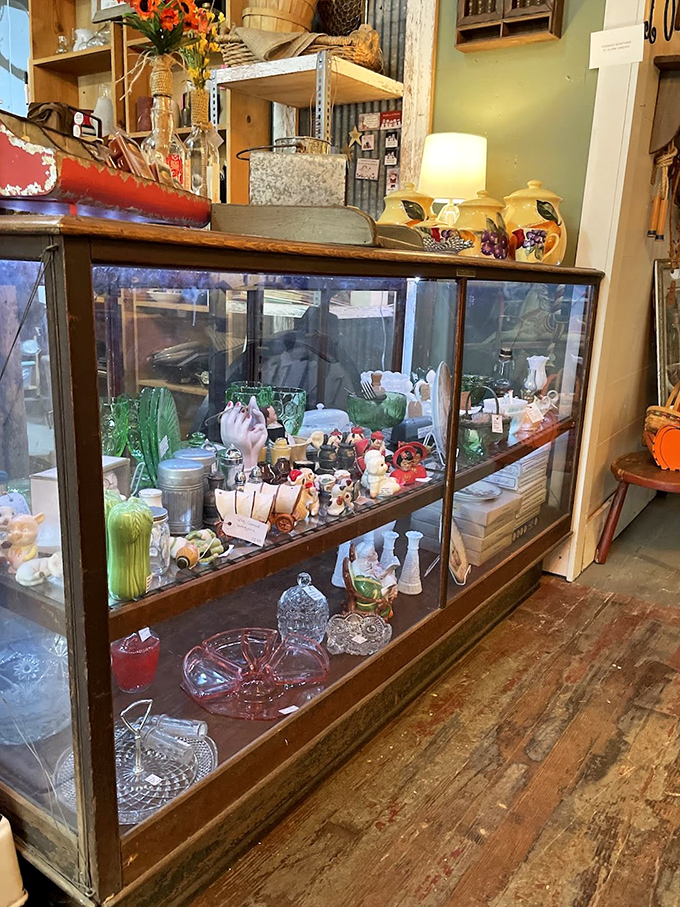 This vintage display case doesn't just hold collectibles&mdash;it's a museum where every tiny treasure tells a story. Window shopping within window shopping!