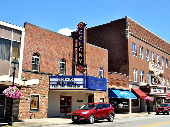 The Colony Theatre's vintage marquee promises entertainment the old-fashioned way. No streaming service can replicate that "night at the movies" feeling.
