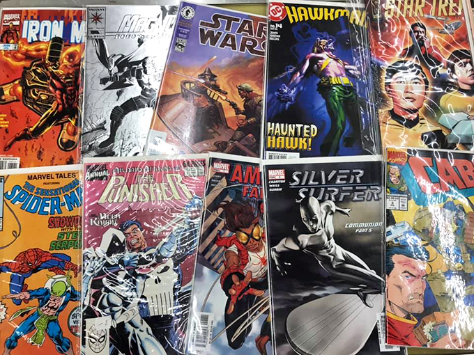 Comic books and vinyl records create a nostalgic corner where your childhood and your parents' teenage years collide.