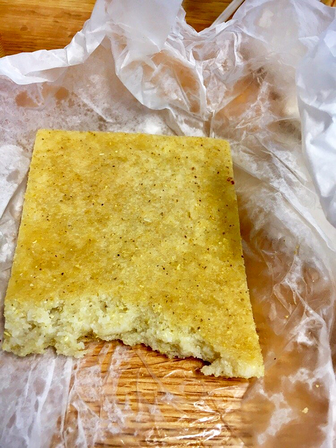 This isn't your grandma's fluffy cornbread. Skylight's dense, savory version with crackling bits is the perfect barbecue wingman.