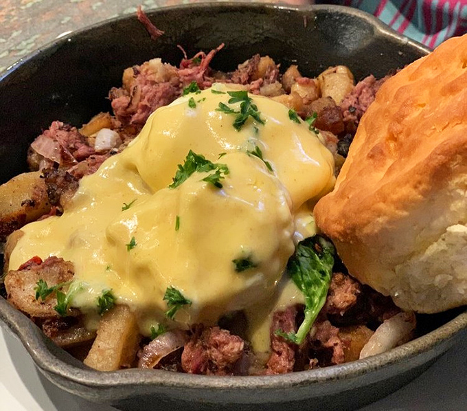 A skillet that means business: potatoes, meat, and hollandaise coming together in a breakfast symphony that Mozart would have written about.