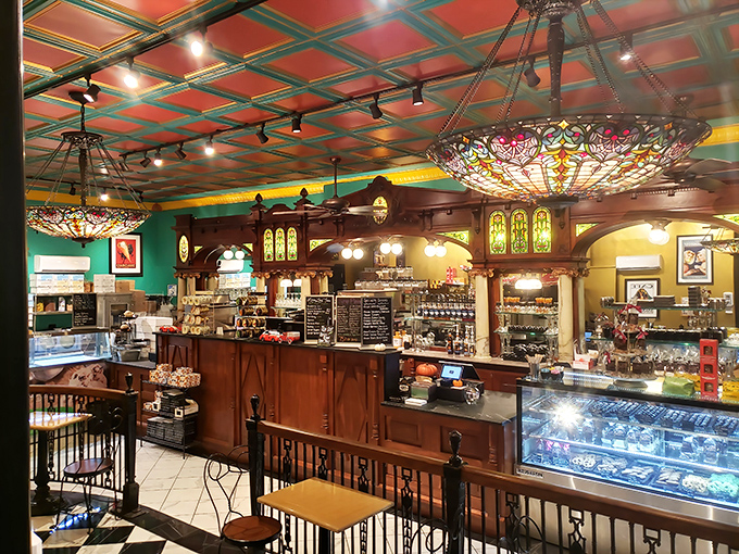 Not your average coffee shop! This richly decorated counter area features stained glass and warm wood tones reminiscent of old-world European craftsmanship.