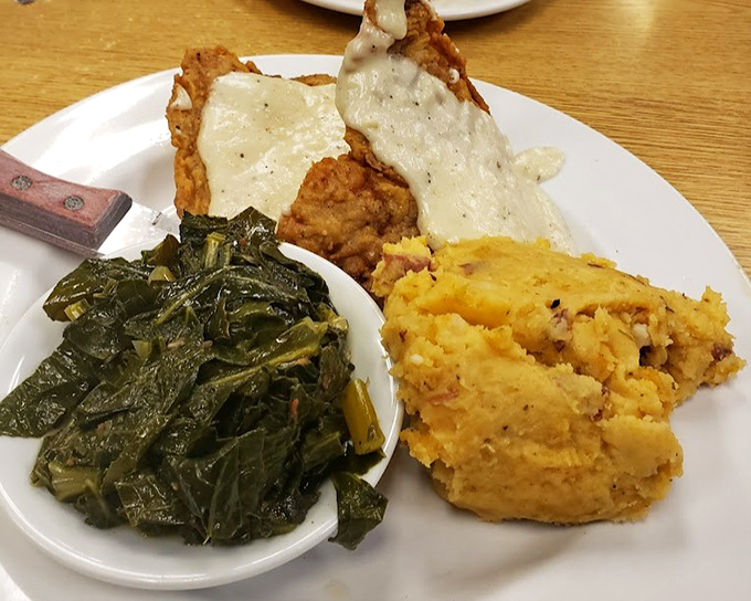 Country fried steak with collards and sweet potato mash. The gravy alone could make a vegetarian question their life choices.