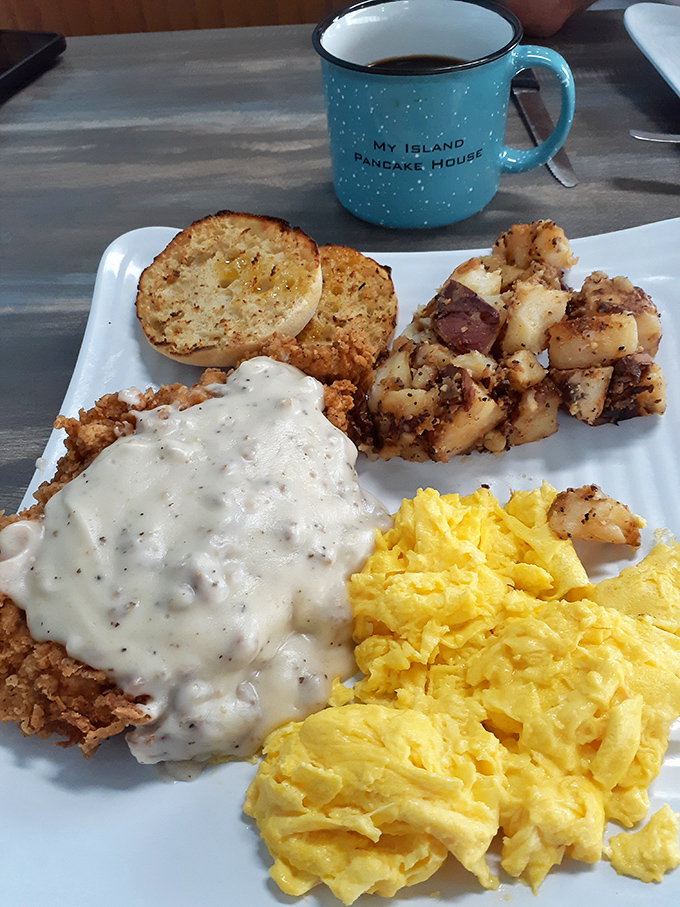 Country fried steak smothered in peppery gravy alongside fluffy scrambled eggs and home fries&mdash;the breakfast equivalent of a warm hug from your favorite aunt.