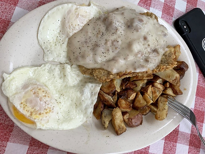 Country fried steak with eggs and home fries &ndash; the breakfast trinity that's converted more morning skeptics than Sunday sermons. That gravy deserves its own zip code.