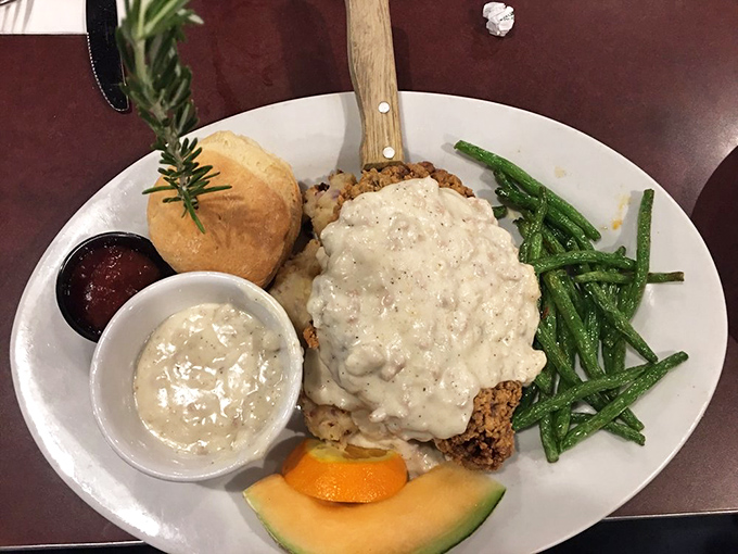 Country fried steak that's been promoted to country estate status, smothered in gravy that could make a vegetarian reconsider life choices.