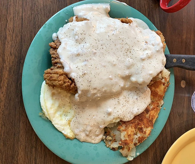 Country fried steak swimming in gravy like it's training for the Olympics. The gold medal for breakfast indulgence goes to...