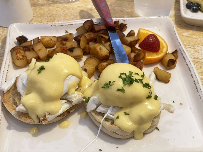 Benedict perfection: English muffins topped with poached eggs and hollandaise that cascades like a golden waterfall of breakfast dreams.