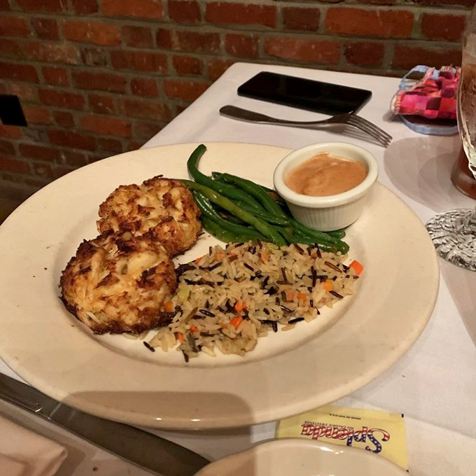 These crab cakes aren't just seafood, they're little golden discs of coastal vacation memories, crispy-edged and served with a sauce worth bottling.