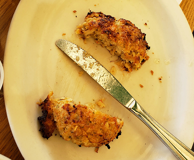 These golden-brown crab cakes aren't just food &ndash; they're edible evidence that simple preparation lets quality ingredients shine brightest.