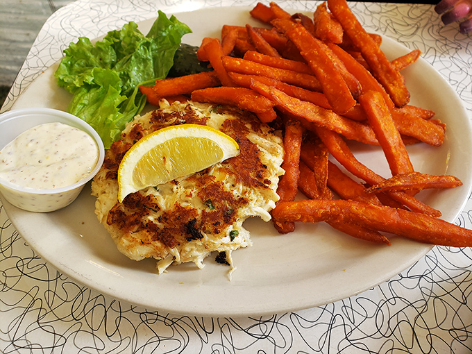The star of the show&mdash;a golden-brown crab cake that's more crab than cake, served with sweet potato fries that could steal the spotlight anywhere else.