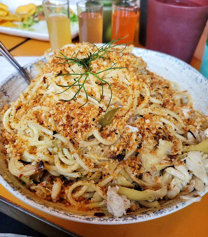 Crispy breadcrumbs crown this crab pasta like a delicious dune, with fresh herbs adding pops of color and bursts of garden-fresh flavor.