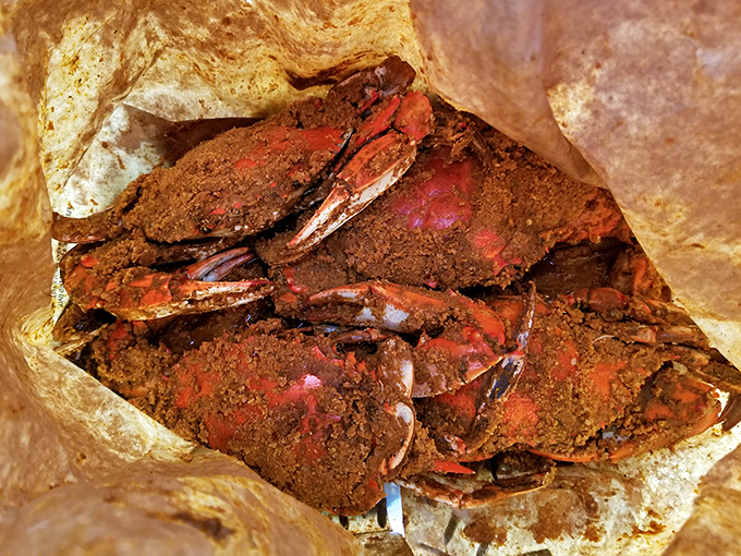 Spice-crusted crabs in their paper cocoon, waiting to be cracked open like nature's most delicious puzzle. Tools and patience required!