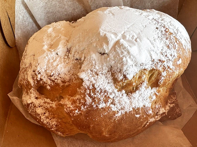 This golden cream puff isn't just baked—it's been lovingly coaxed into existence by hands that understand the sacred relationship between butter and flour.