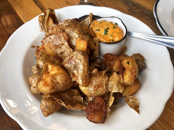 These aren't just potatoes; they're crispy little flavor bombs with a dipping sauce that might make you forget ketchup ever existed.