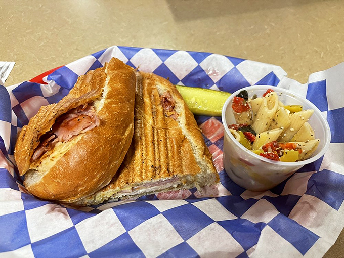 The pressed Cuban sandwich arrives with the confidence of something that knows it's about to become the highlight of your day.