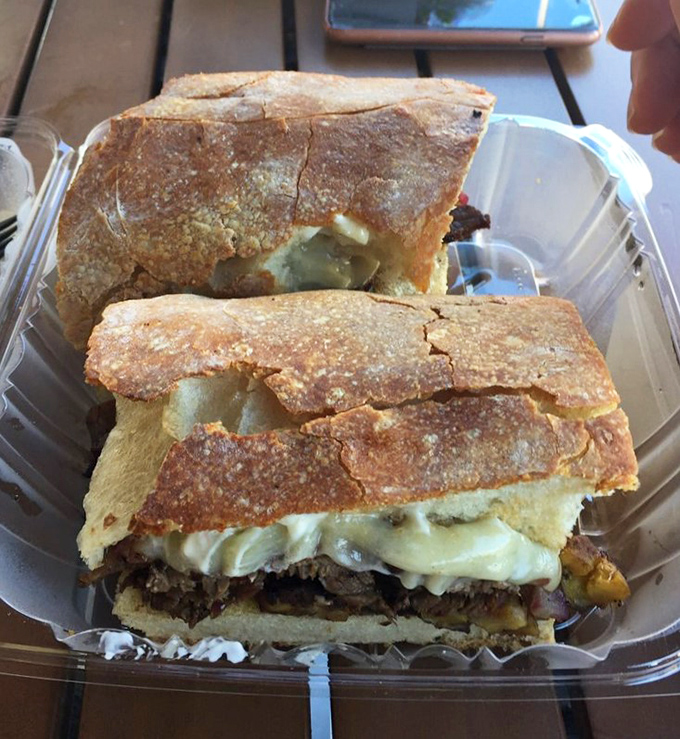 This Cuban sandwich isn't just lunch—it's Miami history between two pieces of bread. That perfect press creates a crispy exterior that audibly shatters with each bite.