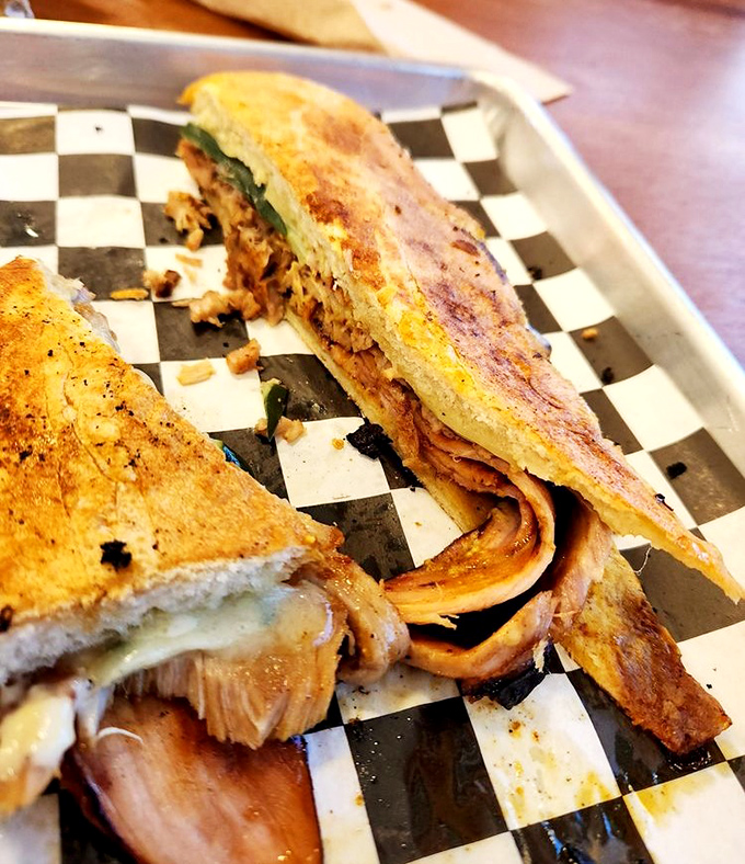 The Cubano: where pork, ham, and pickles throw a party and everyone's invited. Pressed to perfection, it's Florida's answer to sandwich royalty.