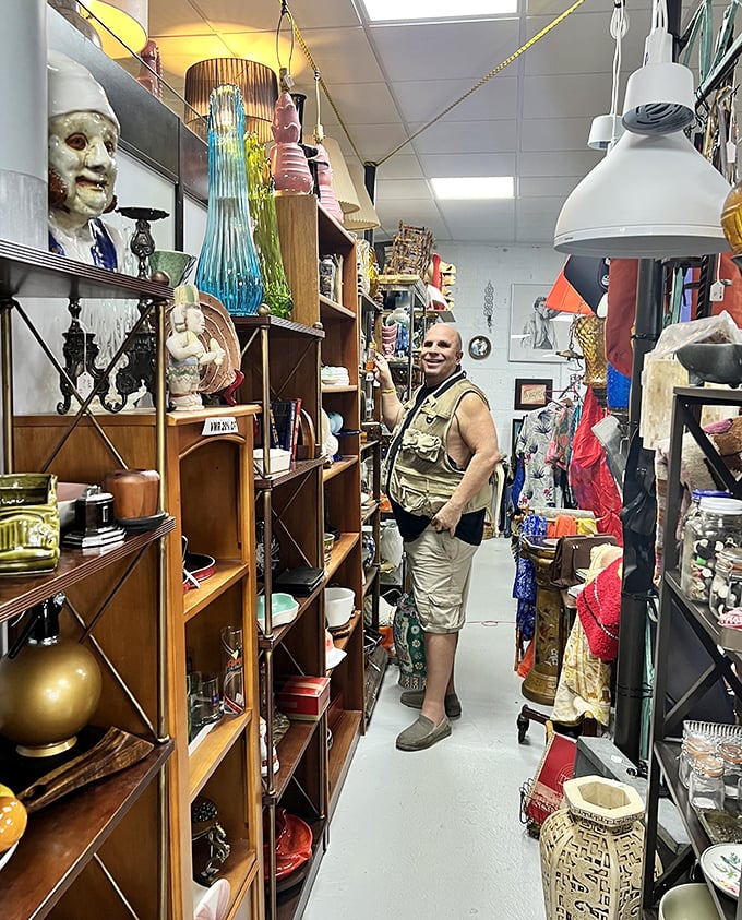 Every aisle at Oddballs becomes a personal expedition. This shopper has the focused look of someone who's just spotted vintage gold among the everyday.
