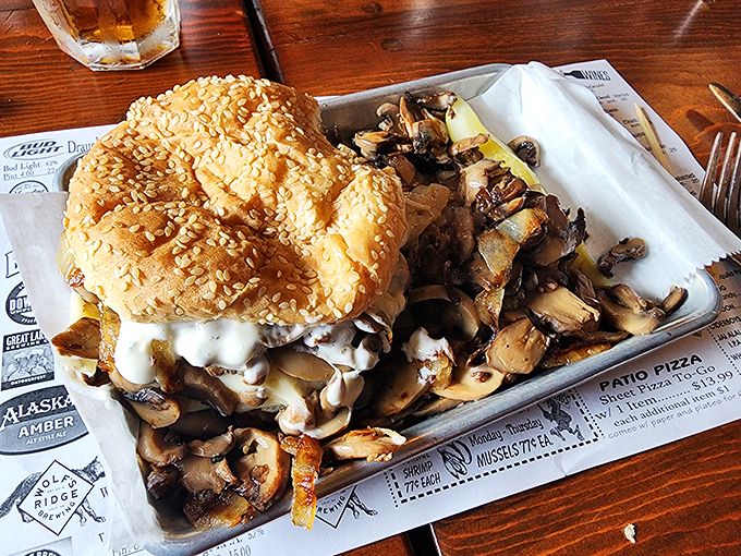 A burger that requires both hands, several napkins, and possibly a signed waiver. Those mushrooms aren't hiding&mdash;they're showing off.