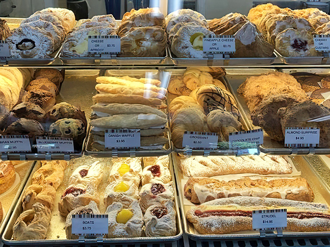 The display case: where diet plans go to die and "I'll just have a bite" becomes the lie you tell yourself before ordering three more.