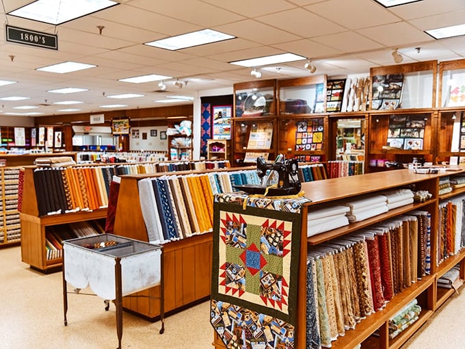 Fabric bolts standing at attention like textile soldiers, ready to be drafted into service for your next quilting masterpiece.