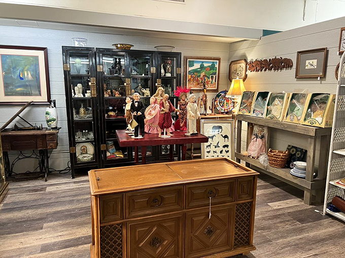 A congregation of porcelain personalities stands at attention, each doll silently volunteering to be the conversation starter in your living room.