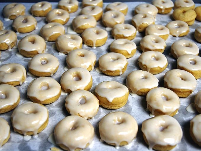 Those donuts are having their moment, glistening like edible jewelry in the case, ready for their close-up.