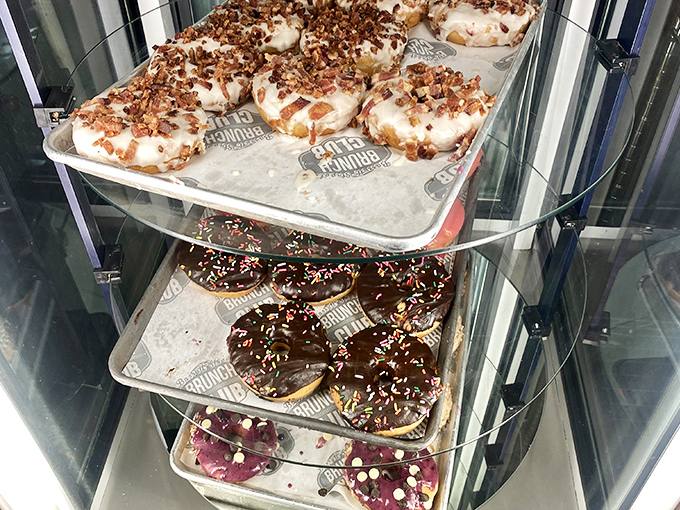 Donut display case or modern art installation? These sprinkle-topped treasures behind glass make a compelling argument for dessert as a breakfast food.