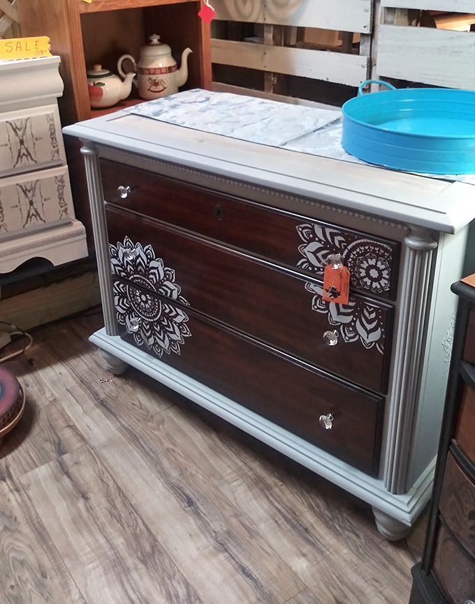 This two-tone dresser with mandala details bridges vintage bones with contemporary flair&mdash;furniture that's lived multiple lives and ready for another.