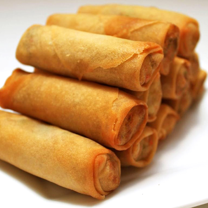 These perfectly rolled, golden-brown spring rolls aren't just appetizers&mdash;they're the opening act to a symphony of flavors waiting in the wings. 
