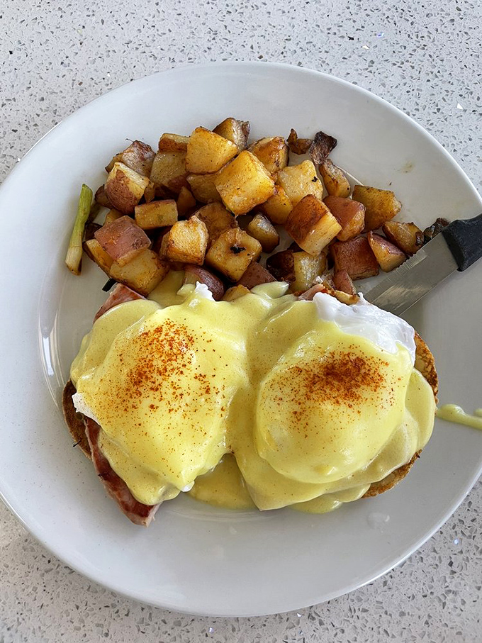 Eggs Benedict done right is culinary poetry. These perfectly poached eggs nestled on Canadian bacon with hollandaise speak the universal language of "yum."